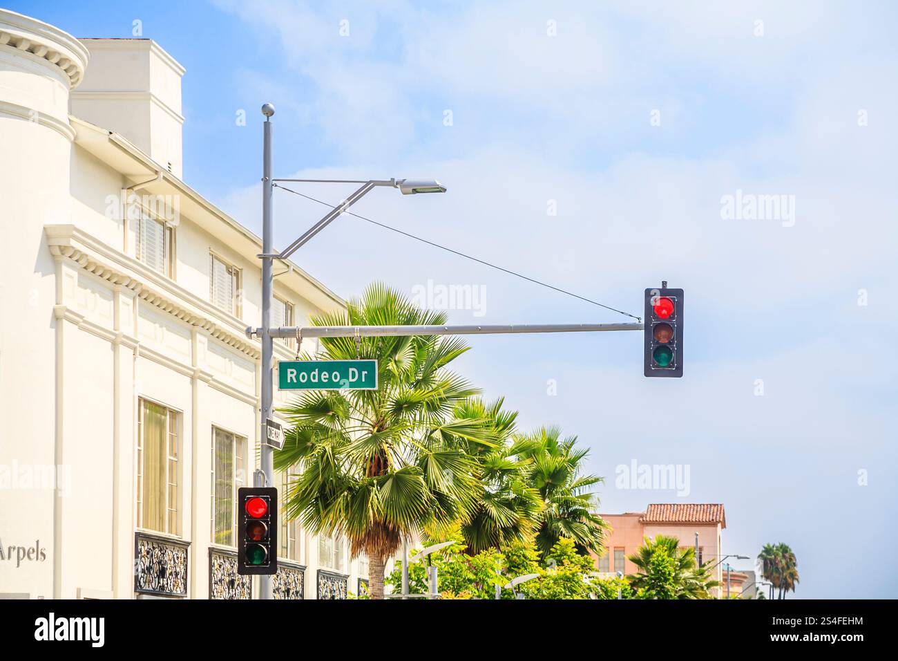 Road name sign of the iconic Rodeo Drive on overhead lamp post traffic ...