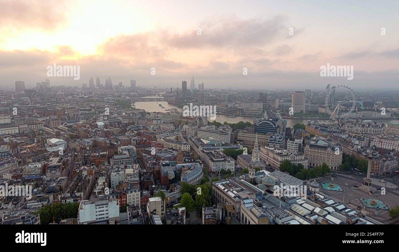 Stunning aerial footage of London's skyline at sunrise, featuring the ...
