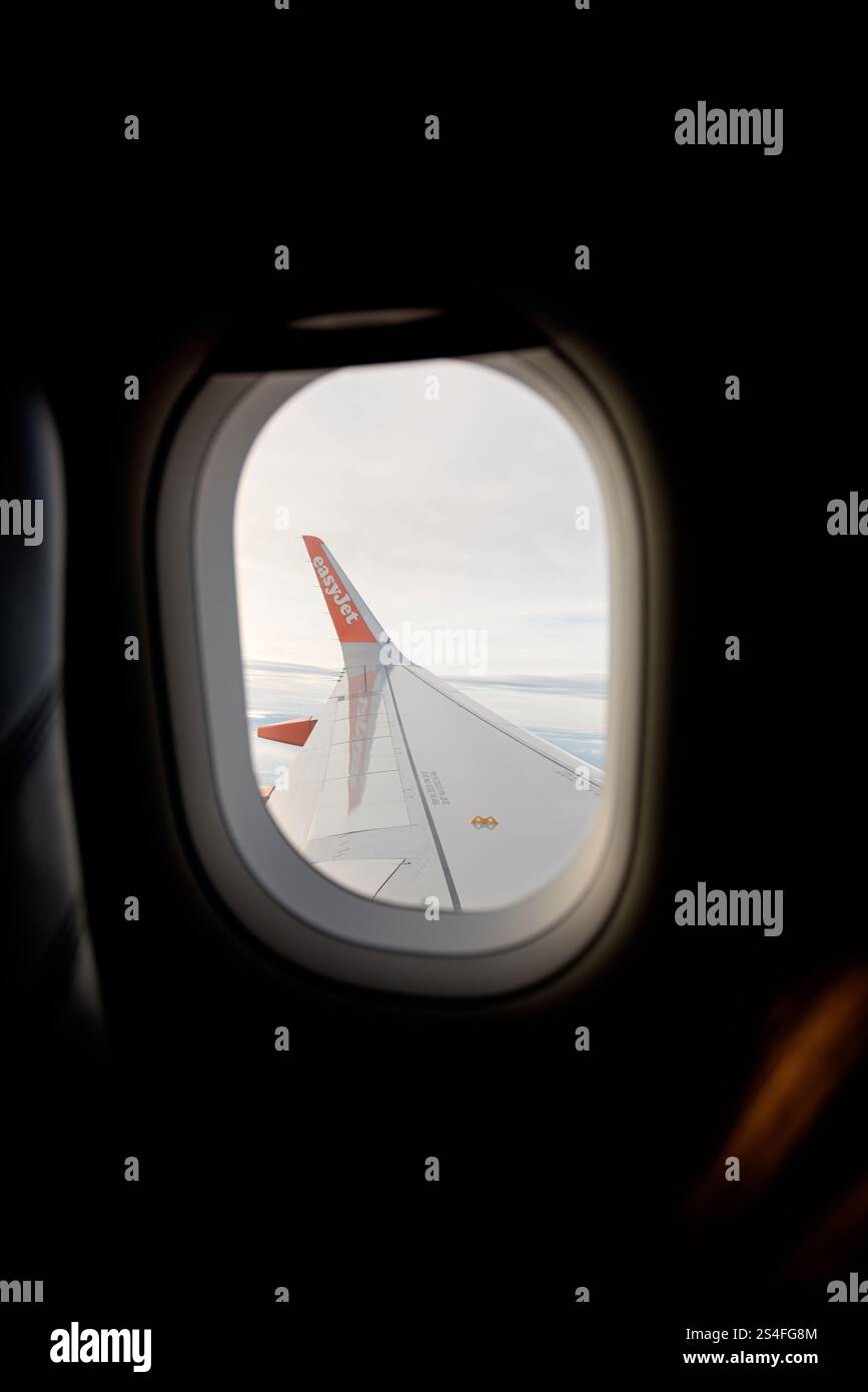 A serene view of the wing of an EasyJet airplane captured through the ...