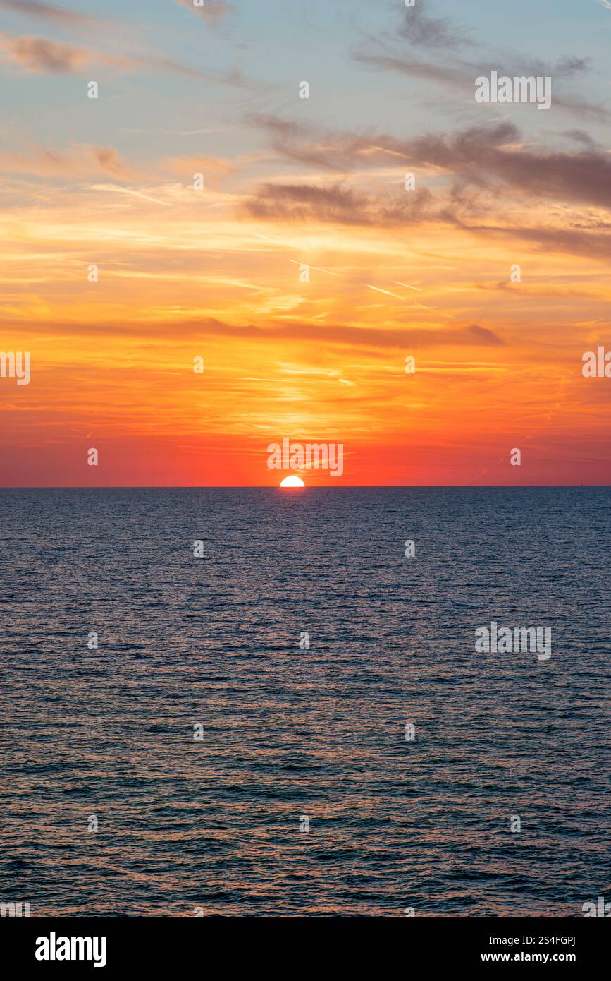 A breathtaking sunset view over the open sea, captured from the deck of ...