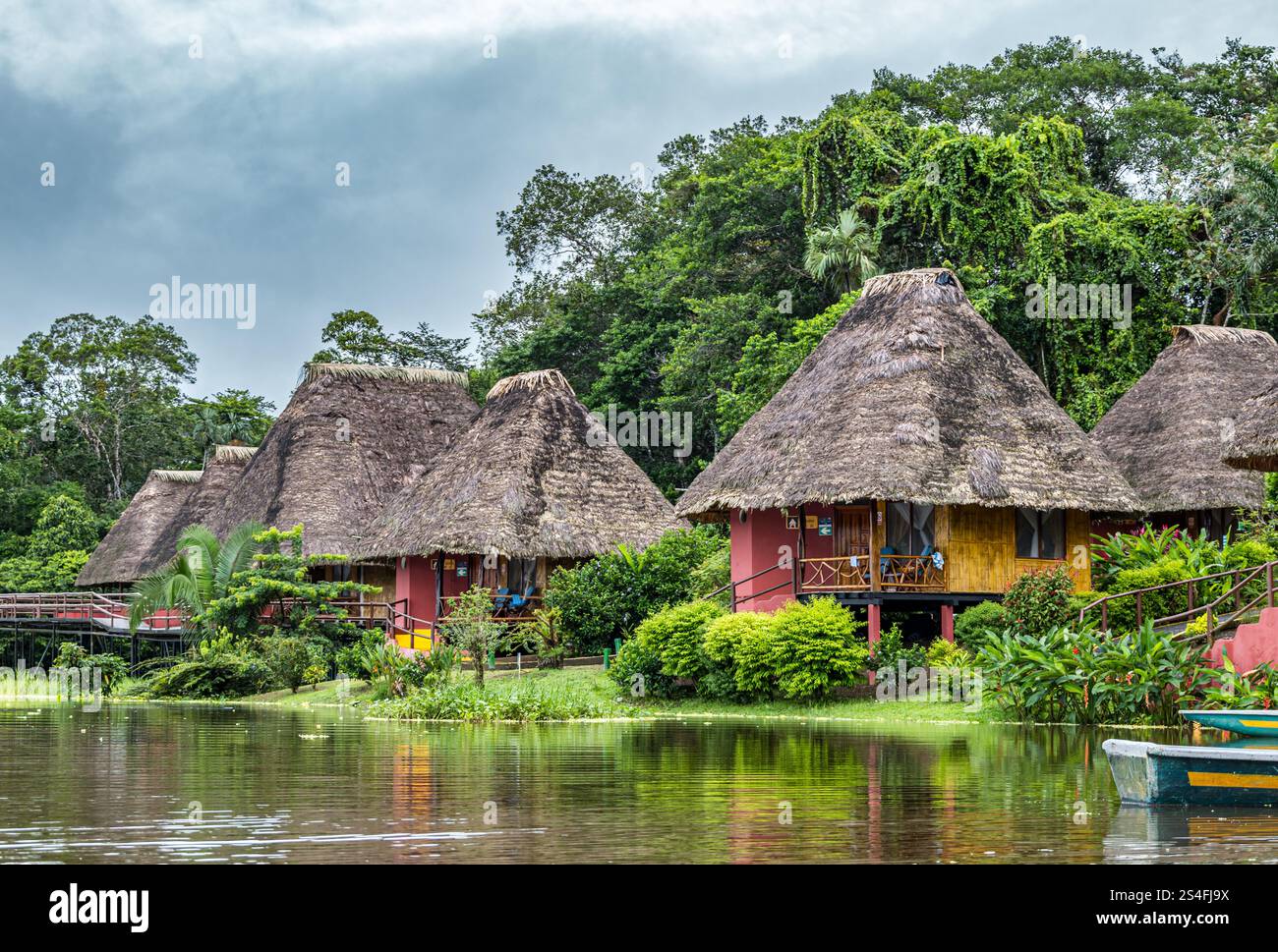 Thatched cabins at lakeside, Napo Eco Lodge, Añangu Lake, Amazon ...