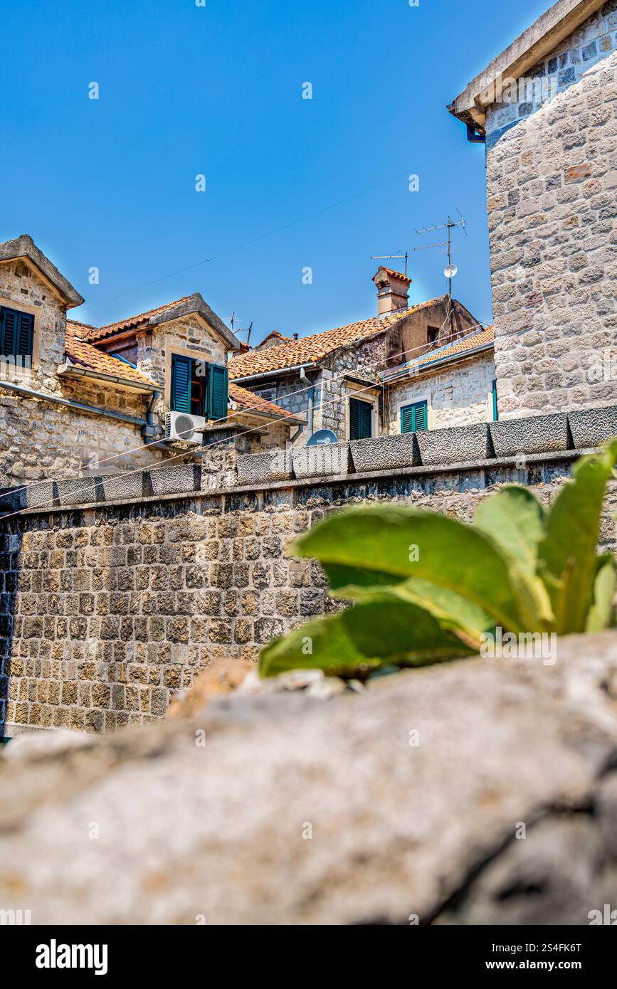 A charming traditional stone house in Kotor, Montenegro, showcasing rustic architecture with a ...