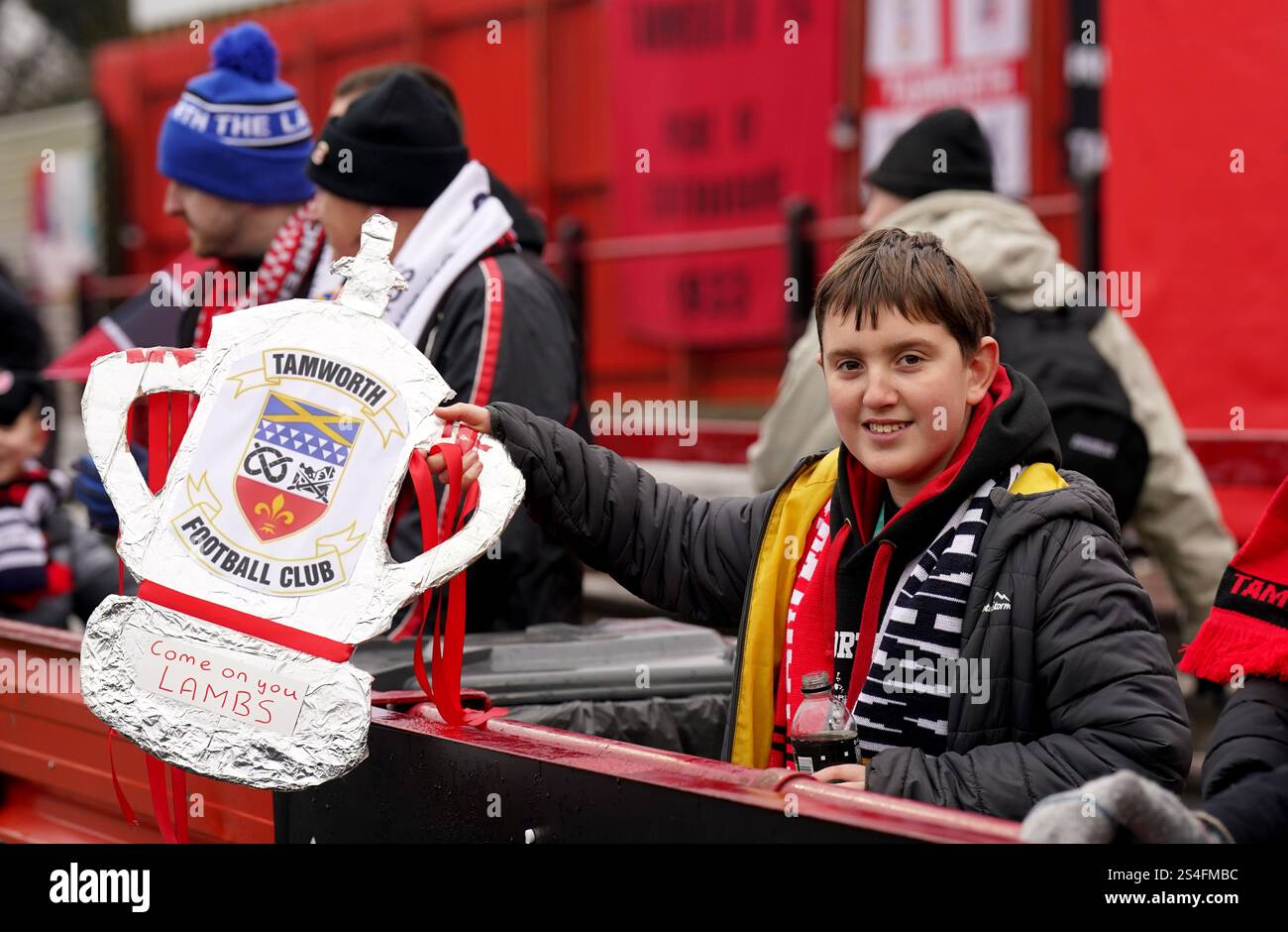A young Tamworth fans with a tin foil trophy before the Emirates FA Cup ...