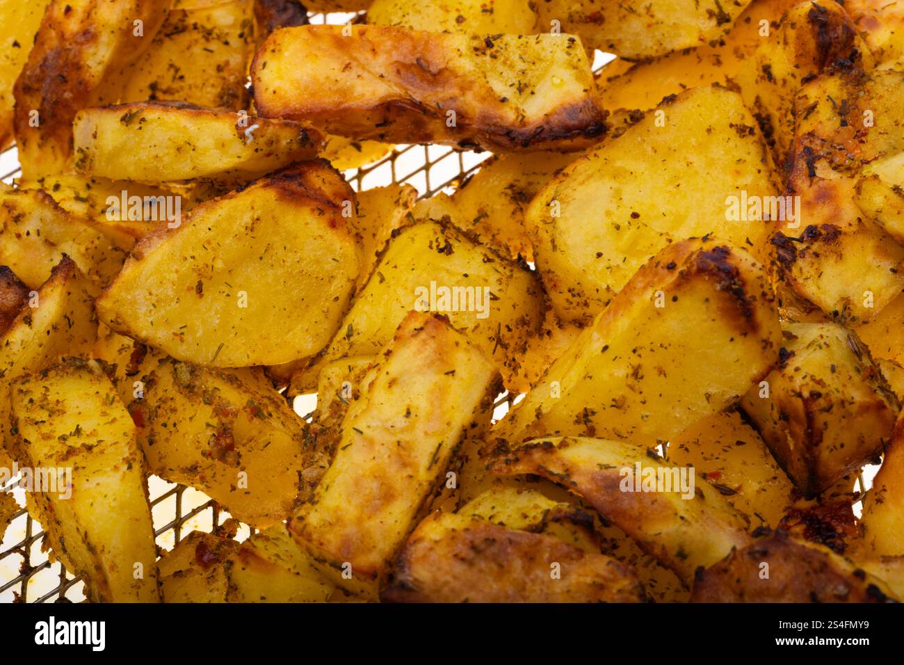 fried potatoes isolated on white background Stock Photo - Alamy