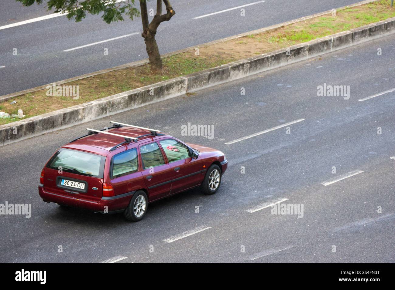 Red ford mondeo estate driving on an asphalt road Stock Photo - Alamy