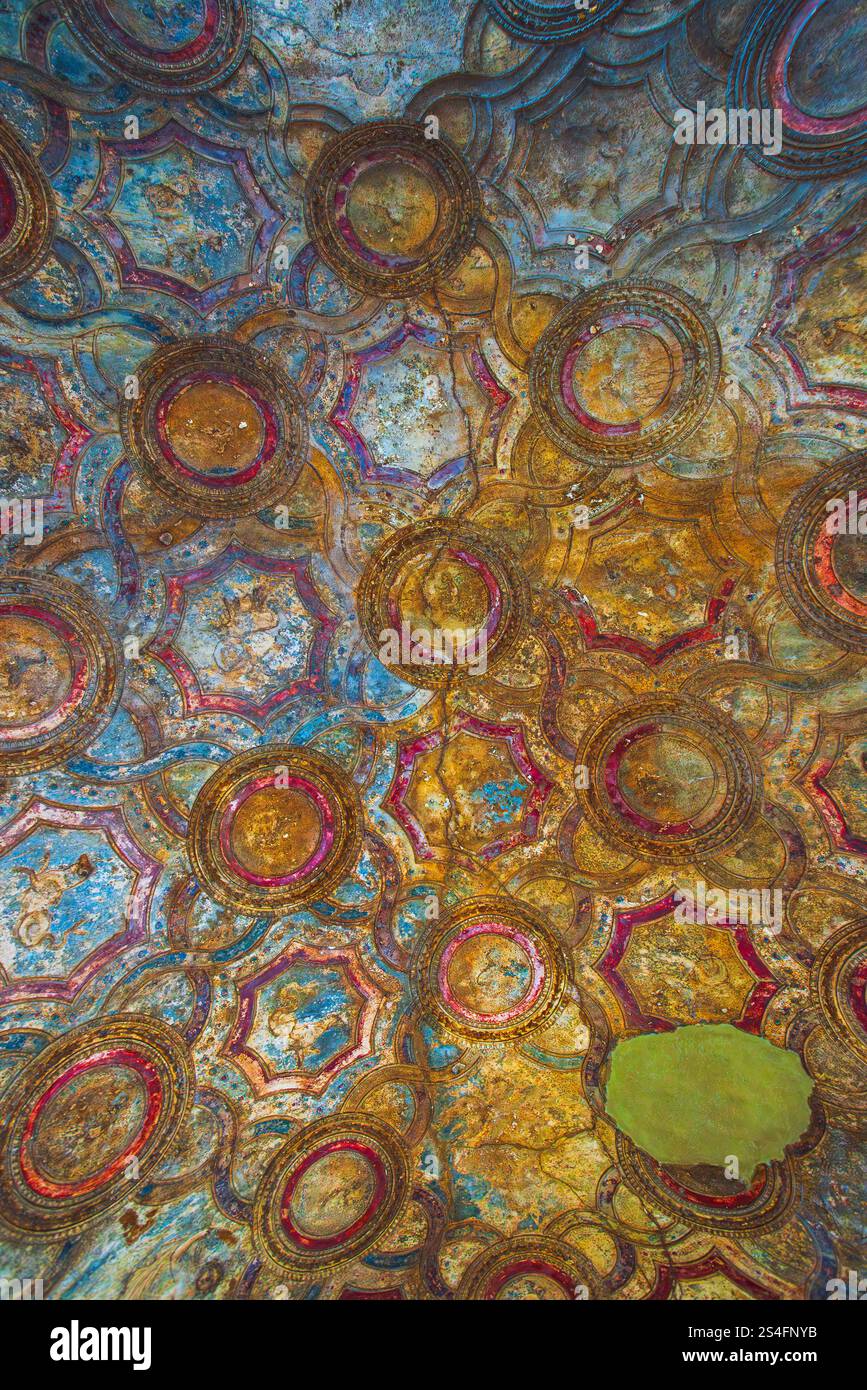 Explore the vibrant ceiling art with intricate circular patterns and ...
