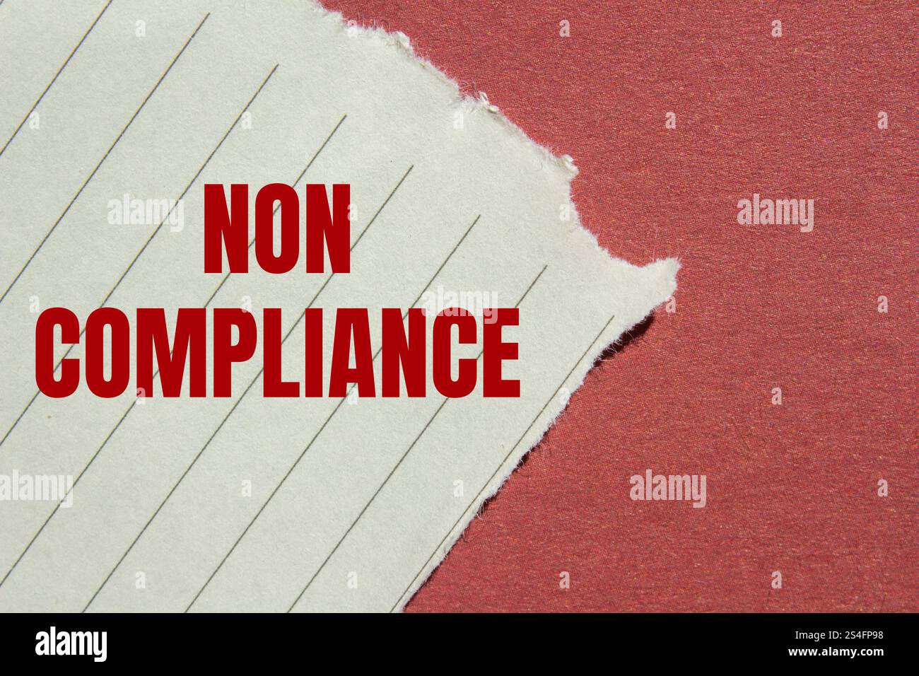 Non compliance message written on ripped torn lined paper with red background. Conceptual non ...