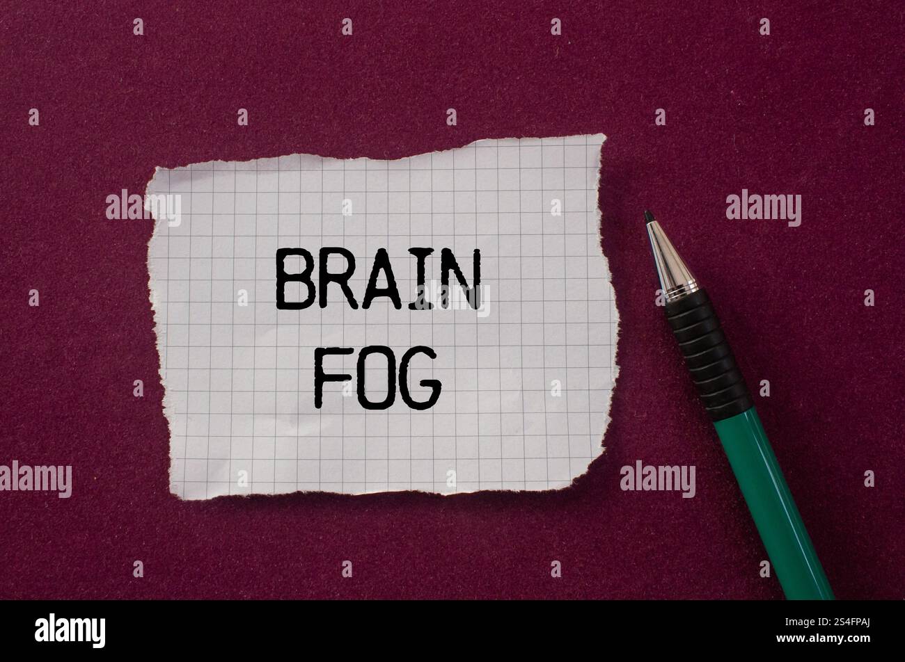Brain fog message written on ripped torn paper piece with purple ...