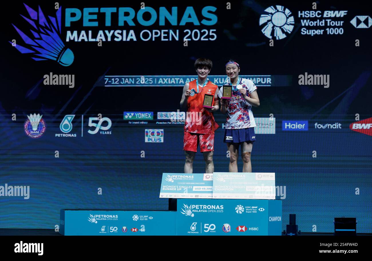 Kuala Lumpur, Malaysia. 12th Jan, 2025. An Se Young (R) of Korea and Wang Zhi Yi of China pose ...