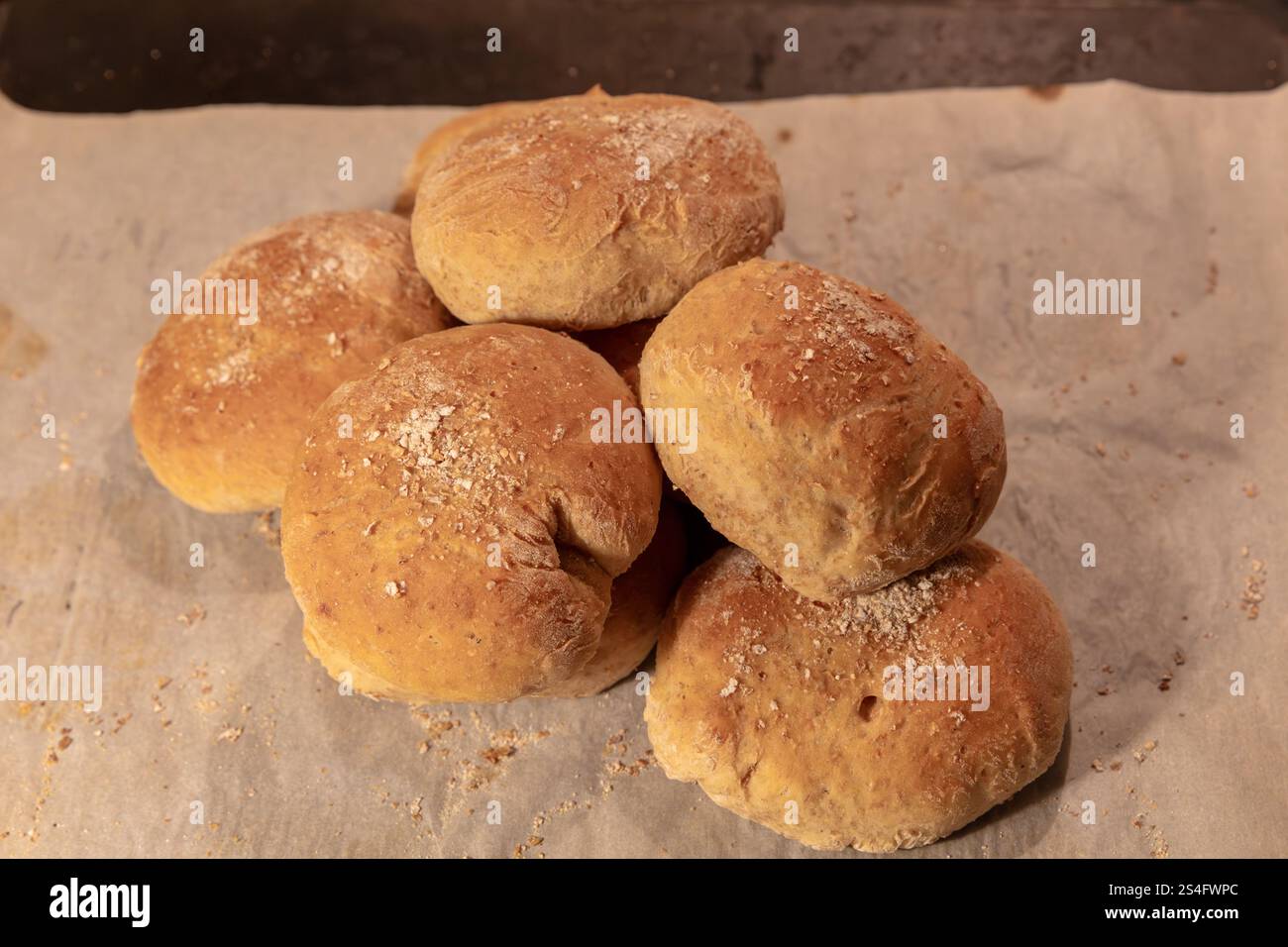 Graham flour bread buns newly baked on oven plate Stock Photo - Alamy