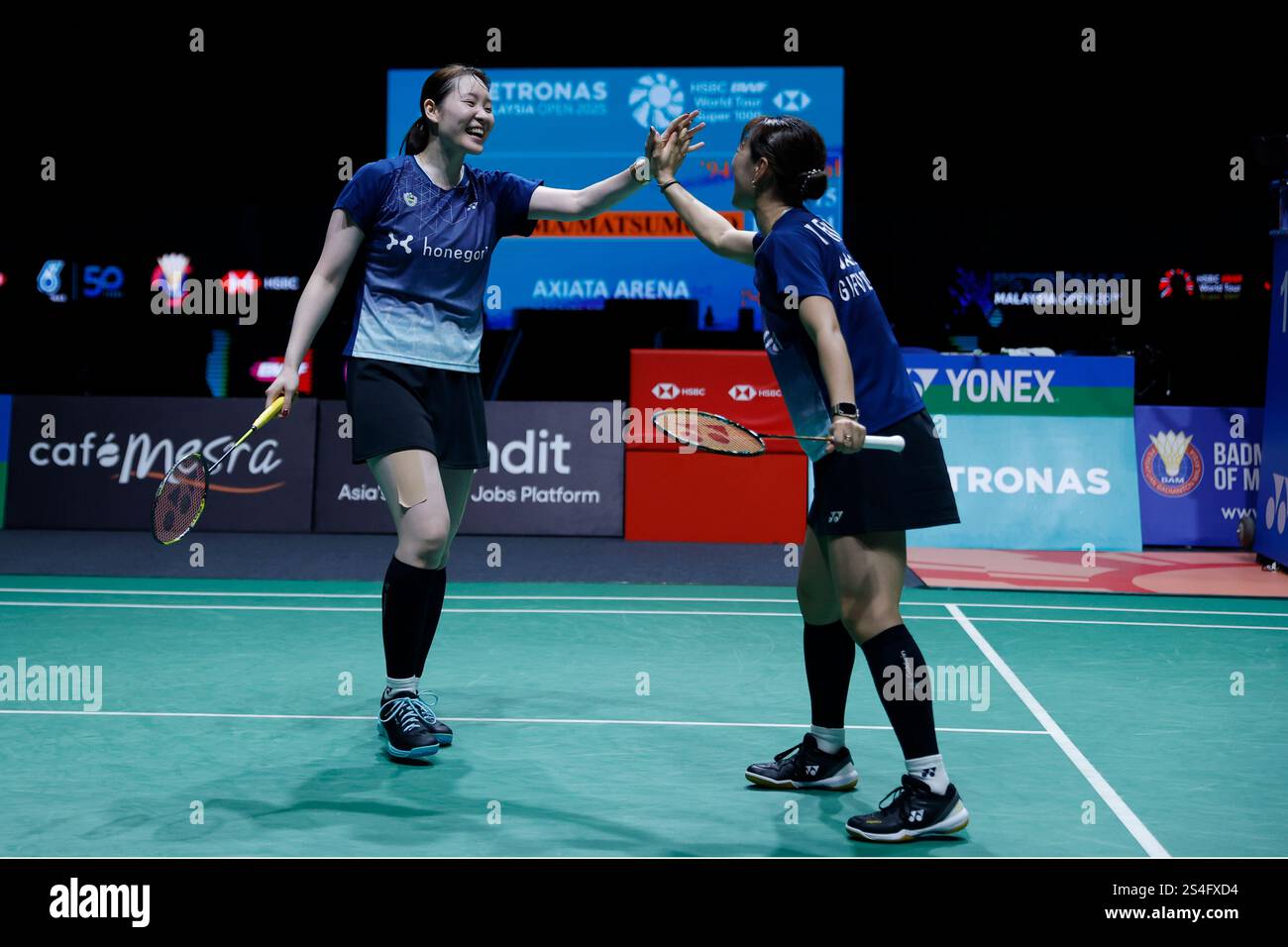 Kuala Lumpur, Malaysia. 12th Jan, 2025. Yuki Fukushima (R) and Mayu Matsumoto of Japan celebrate ...
