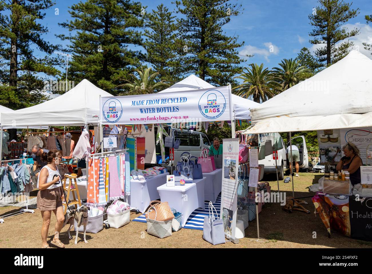 Market stall vendor selling funky bags made from recycled water bottles ...