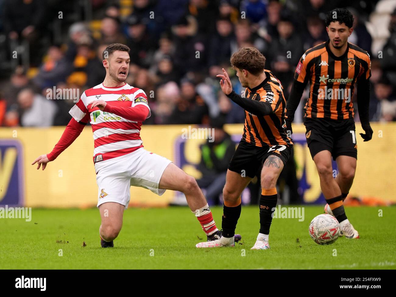 Doncaster Rovers Luke Molyneux (left) and Hull City's Regan Slater ...