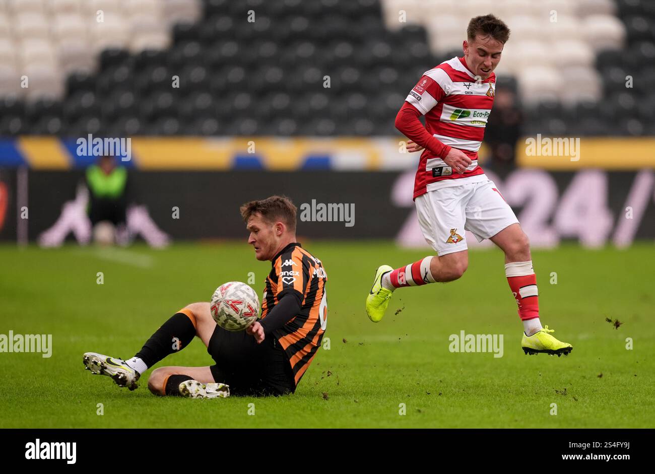 Doncaster Rovers Joseph Sbarra (left) and Hull City's Sean McLoughlin ...
