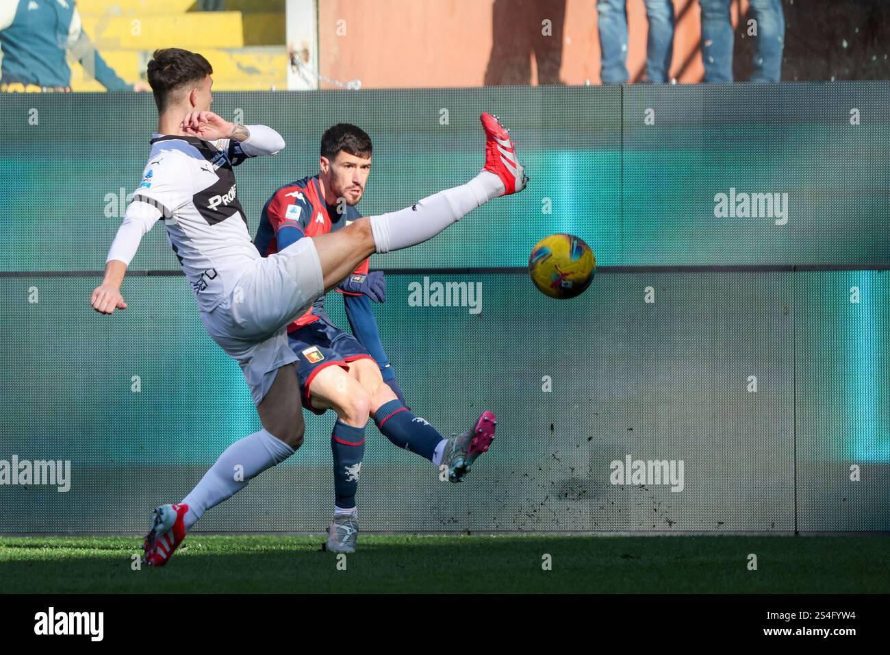 Genoa's Aaron Martin, background, controls the ball, during the Serie A ...