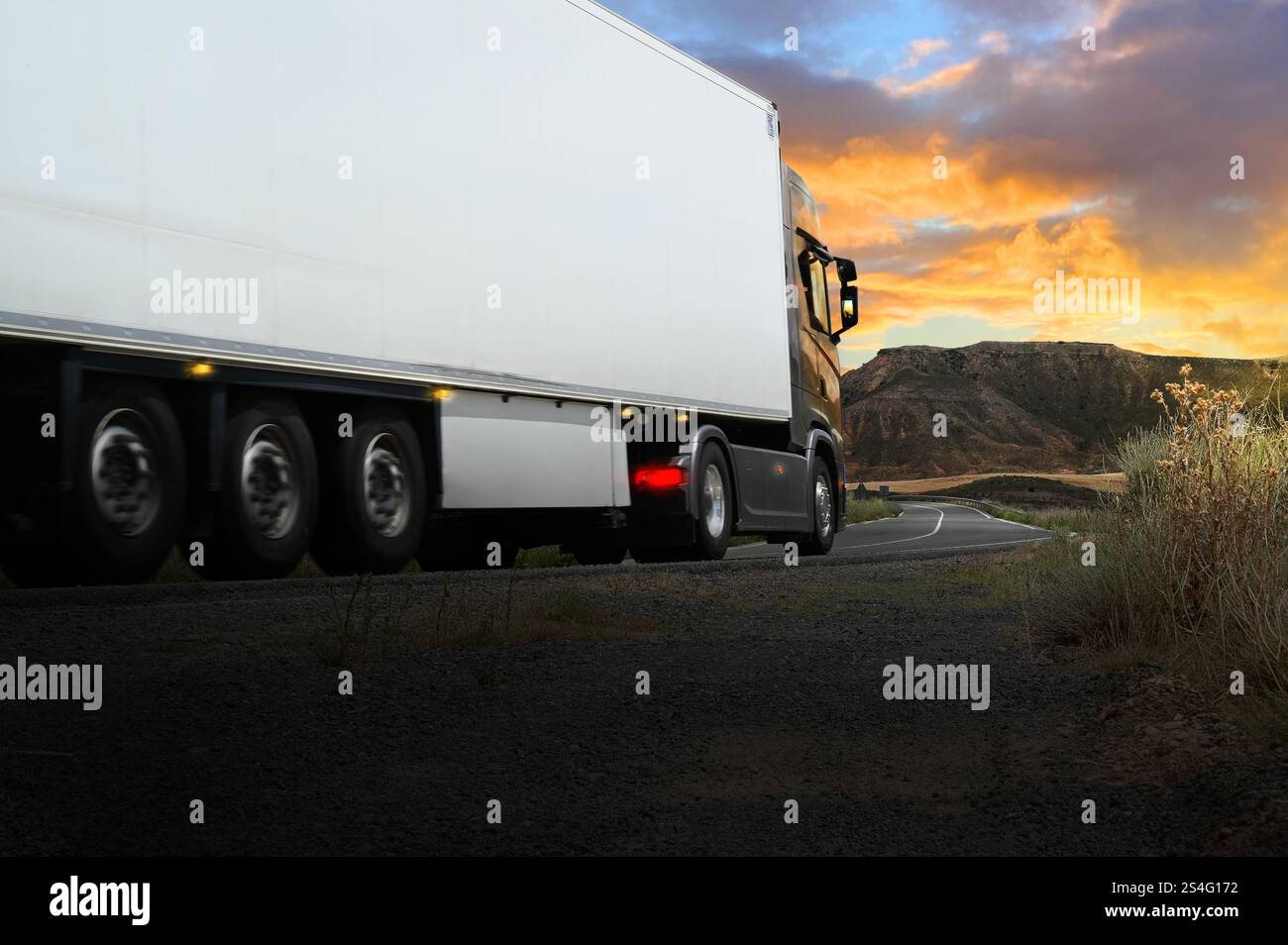Truck lorry van of a haulage company drives on the motorway road at ...