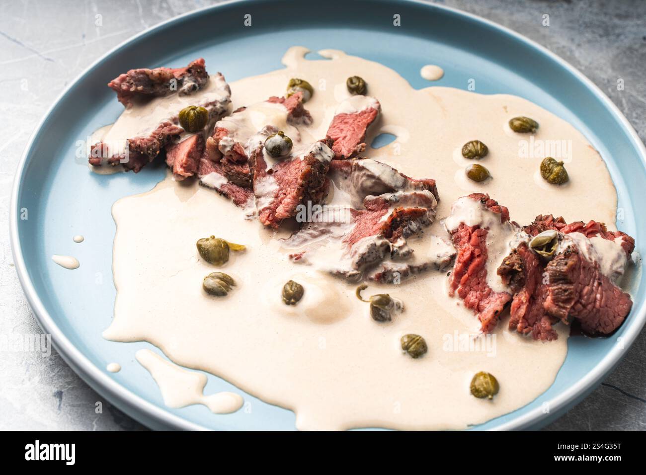 Vitello tonnato a traditional Italian dish of meat with tuna and ...
