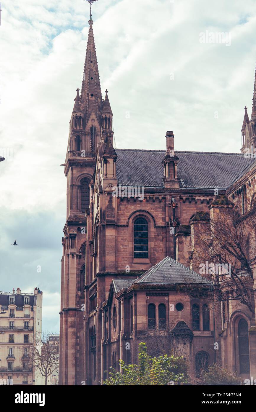Beautiful Gothic architecture of a church in a cityscape under a cloudy ...