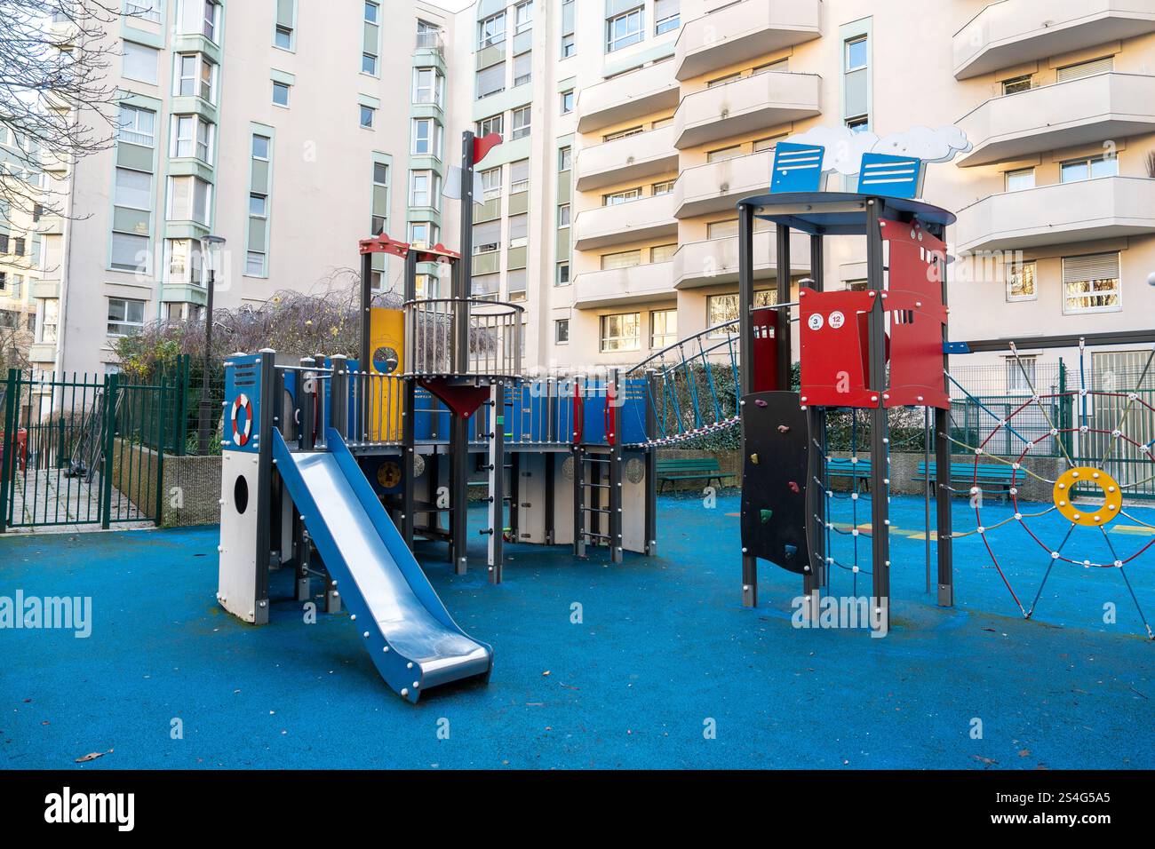 Colorful playground equipment in urban setting designed for children ...