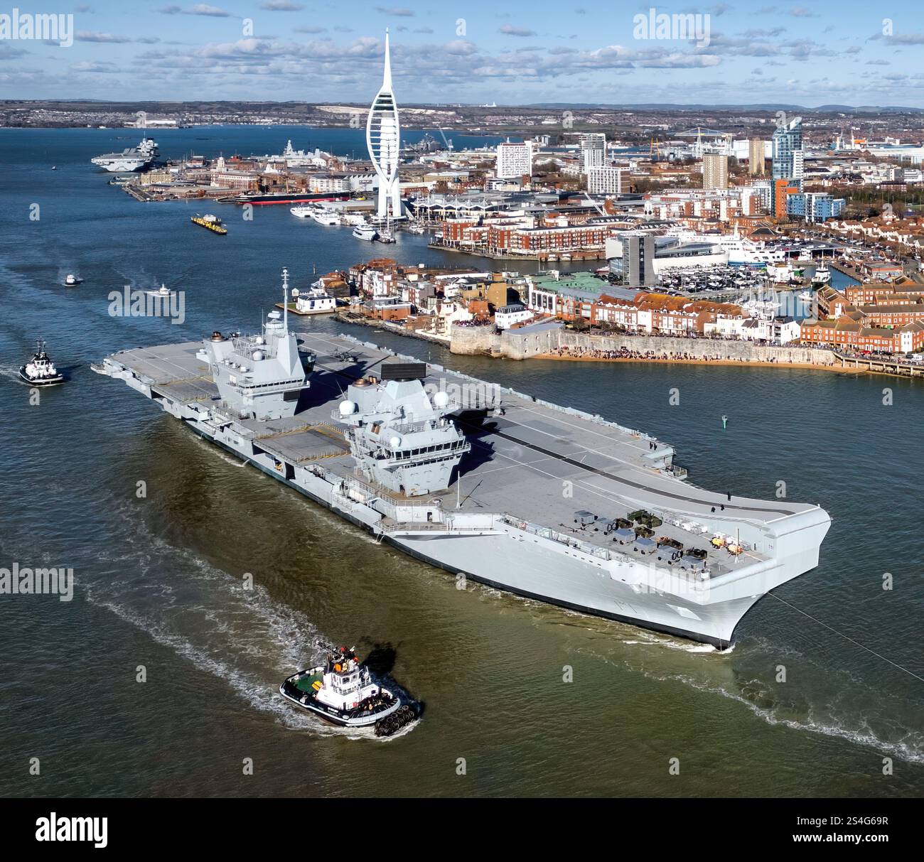 Aerial view of the Royal Navy aircraft carrier HMS Prince of Wales (R09) departing Portsmouth ...