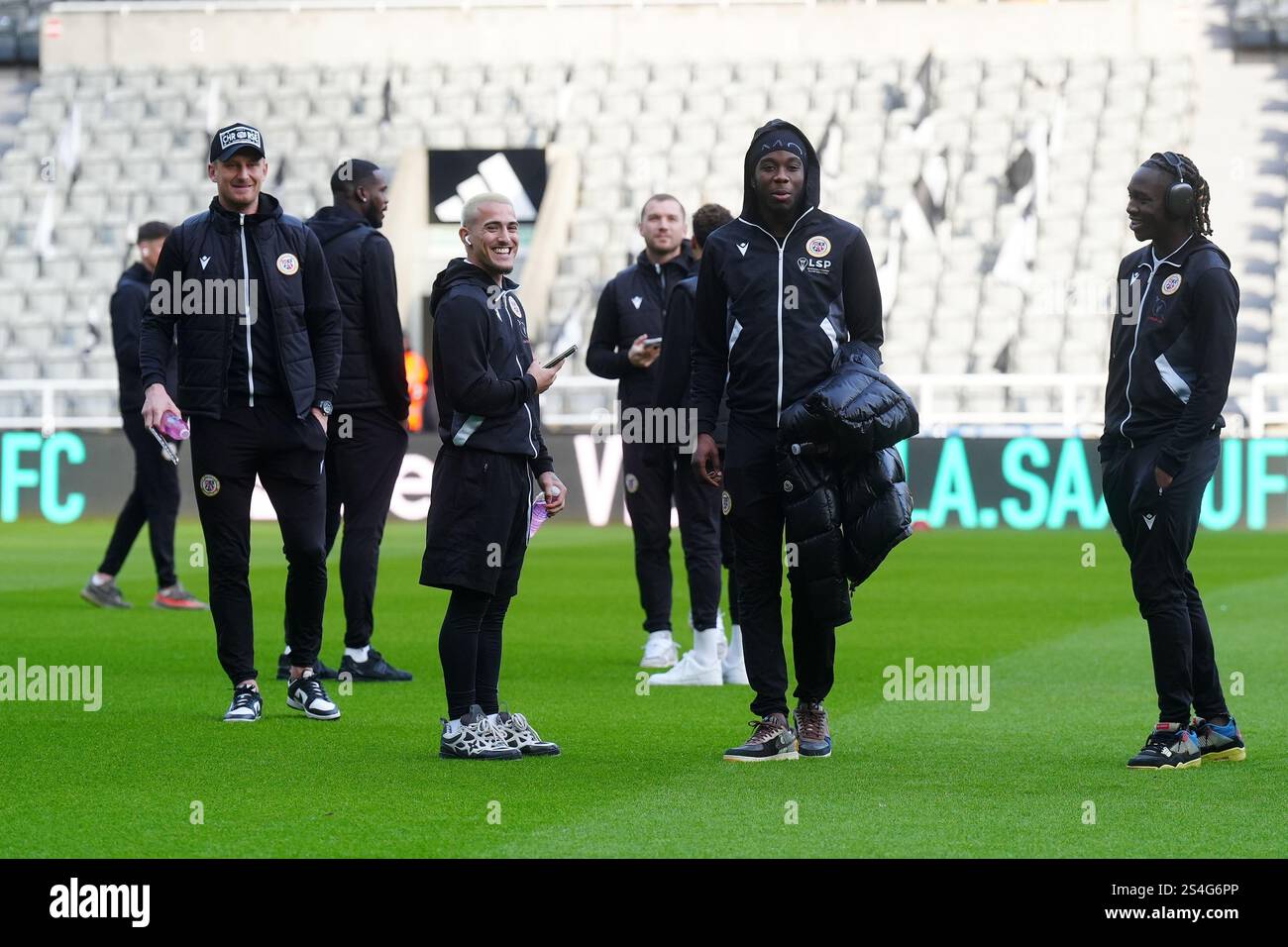 Bromley's Danny Imray (third left) and team-mates inspect the pitch ...
