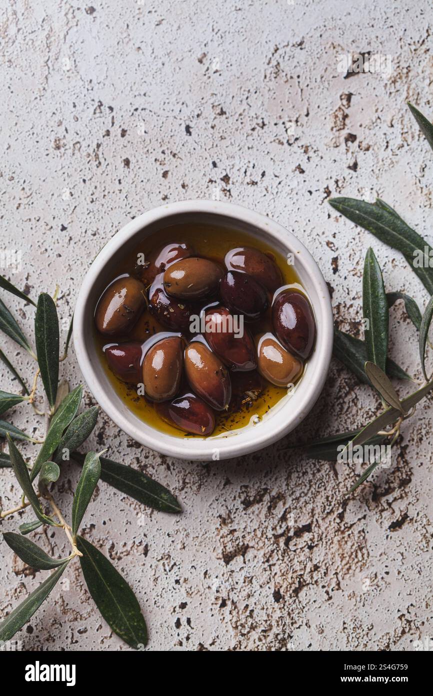 Natural kalamata olives in olive oil with spices, top view ...