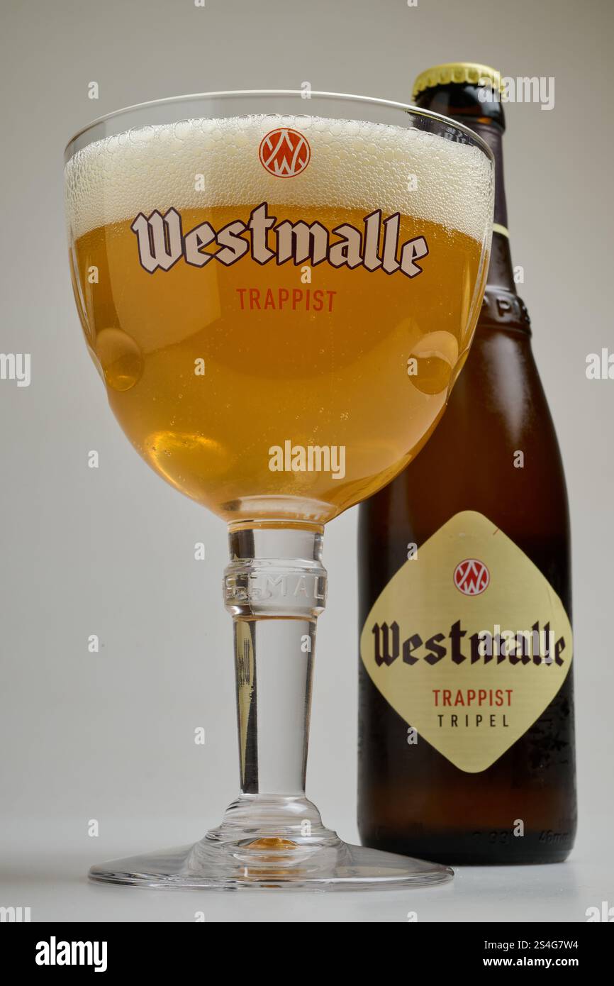 BRUSSELS, BELGIUM - January 12, 2025: Filled glass and bottle of a authentic tripel Westmalle ...