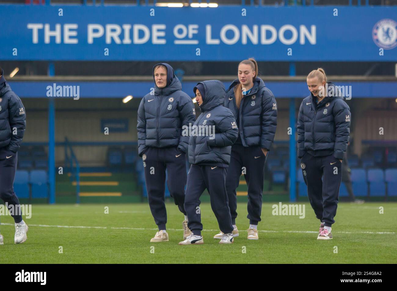 Kingston, UK. 12th Jan, 2025. Chelsea players inspect the pitch ahead ...