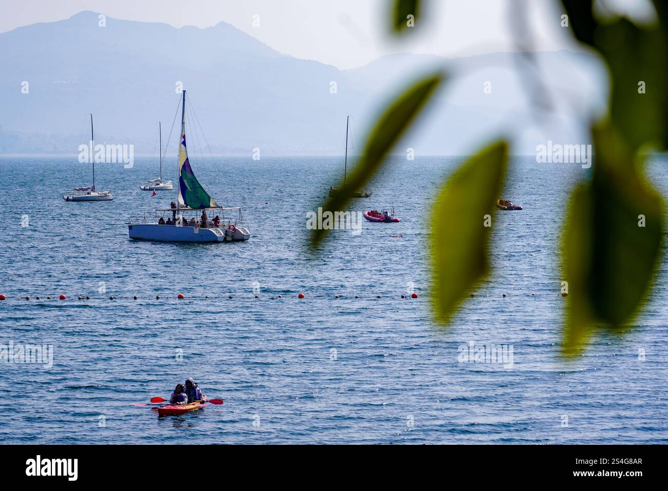 Yuxi, China's Yunnan Province. 12th Jan, 2025. Tourists sail on Fuxian ...