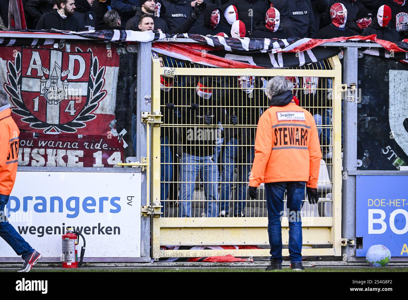 Antwerp, Belgium. 12th Jan, 2025. Antwerp hooligans try to break the ...