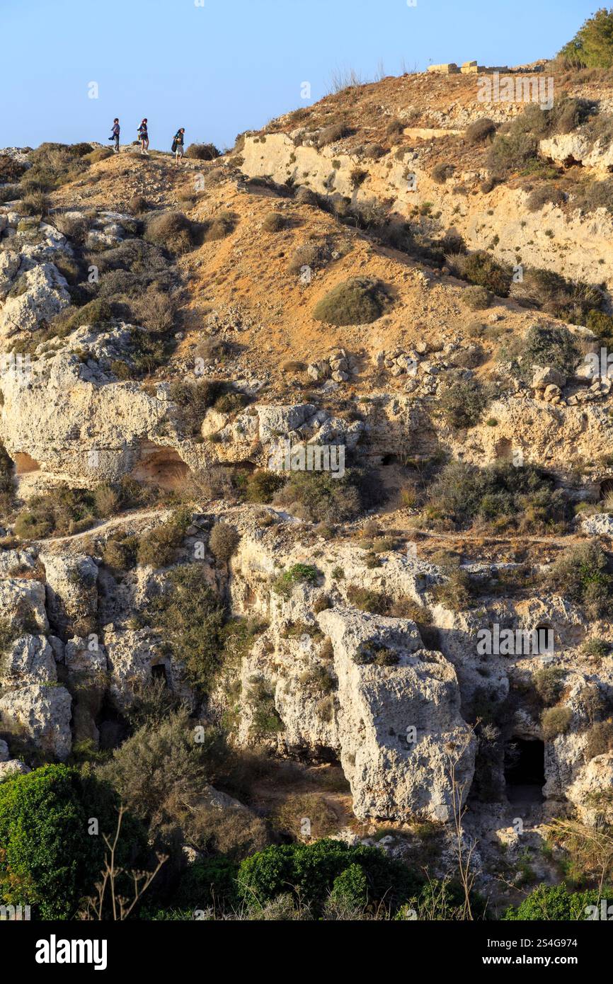Three people walking the Victoria Lines, Malta Stock Photo - Alamy
