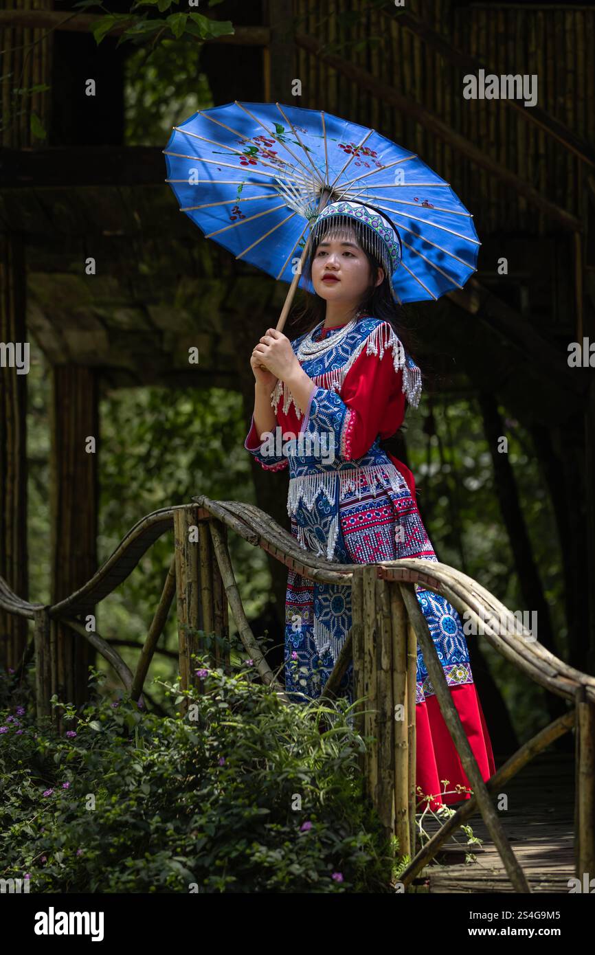 Asian girl in traditional dress costume outdoor in forest. Beautiful ...