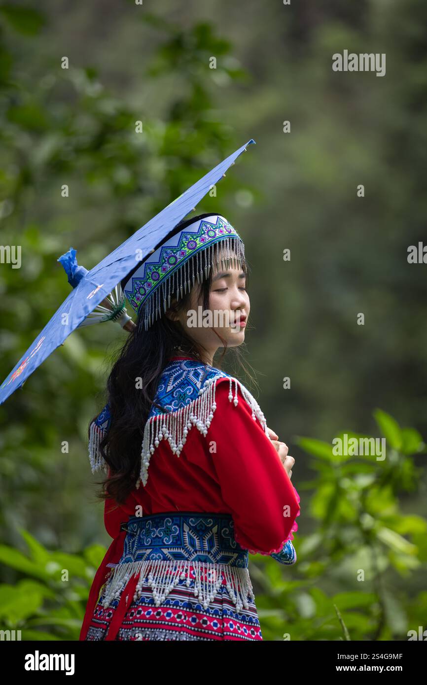 Asian girl in traditional dress costume outdoor in forest. Beautiful ...