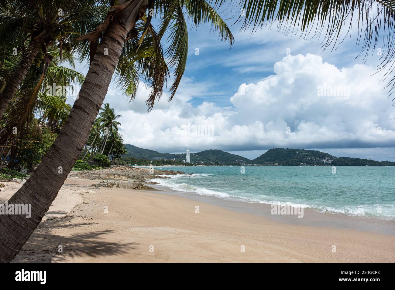 A beach with a beautiful coast, palm trees and the Andaman Sea ...