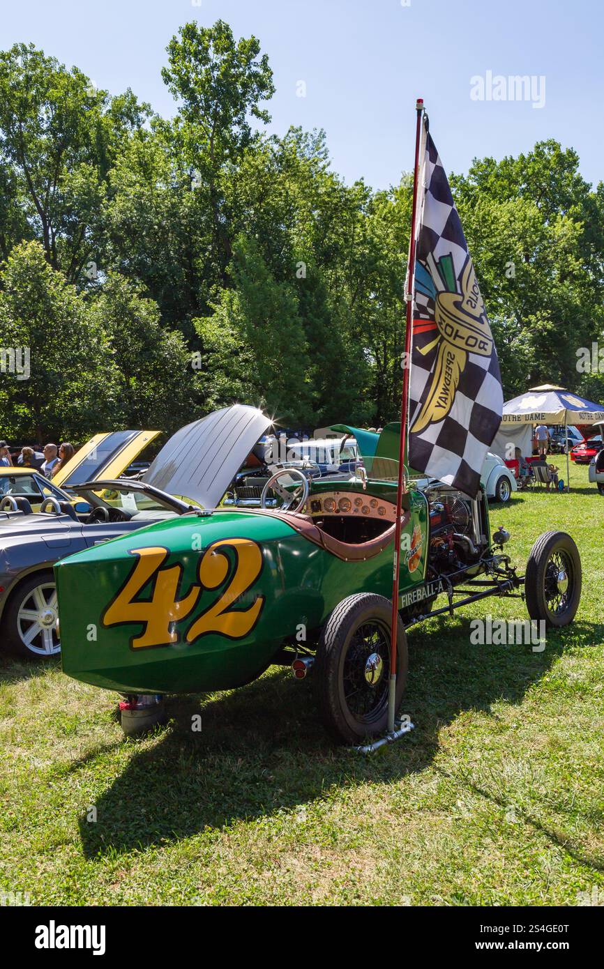 A Buick Fireball Indy car replica on display in a car show at a park in ...