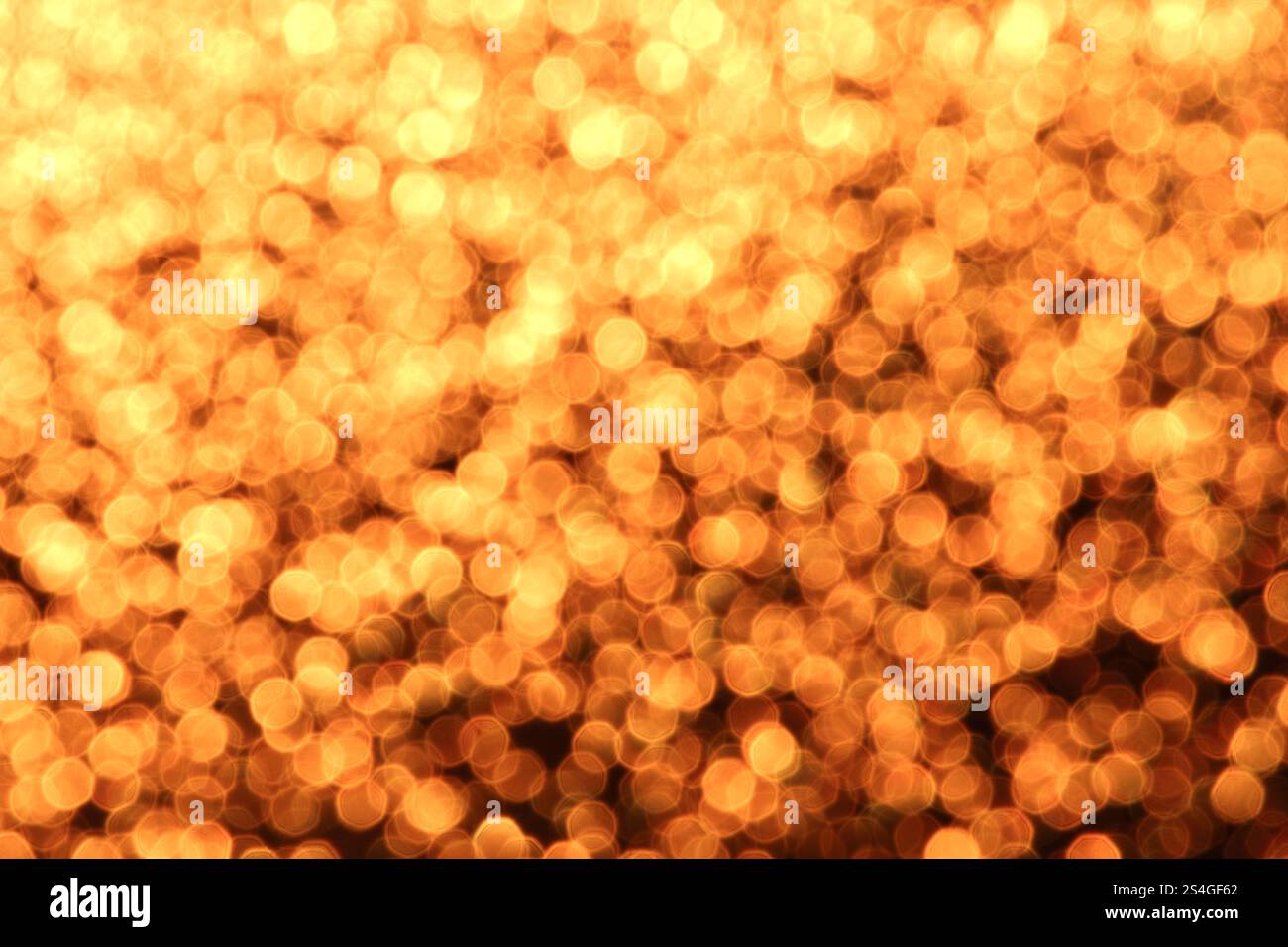 A bokeh effect photograph, out of focus lights creating a golden ...