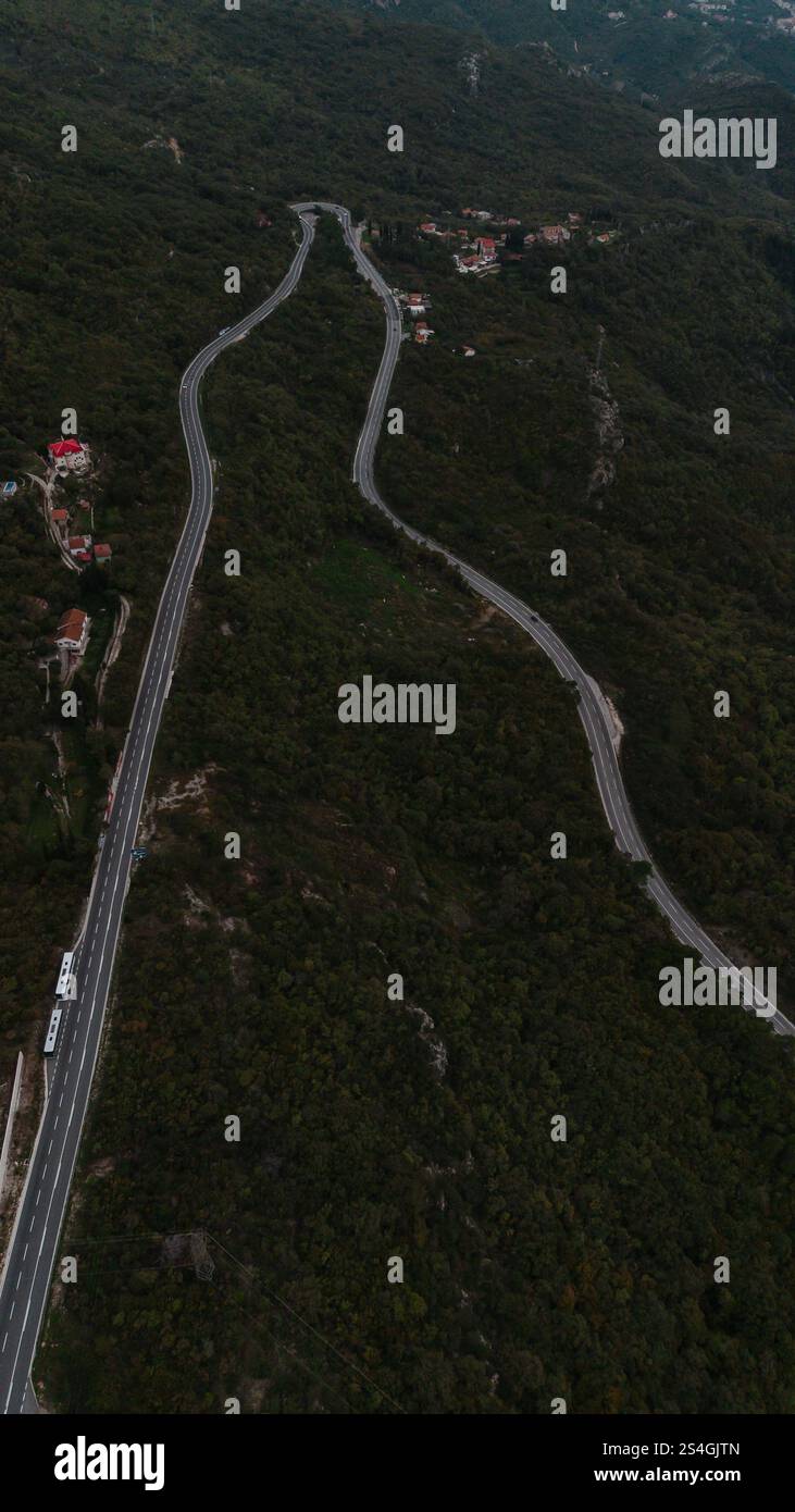 Aerial view from a drone of a highway in the mountains in the direction ...