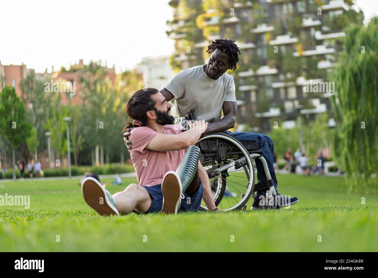Two friends, one with a prosthetic leg and the other using a wheelchair ...