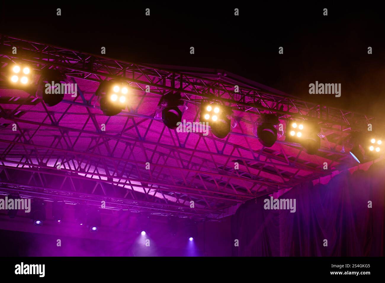 Close-up view of professional stage lighting mounted on metal truss ...