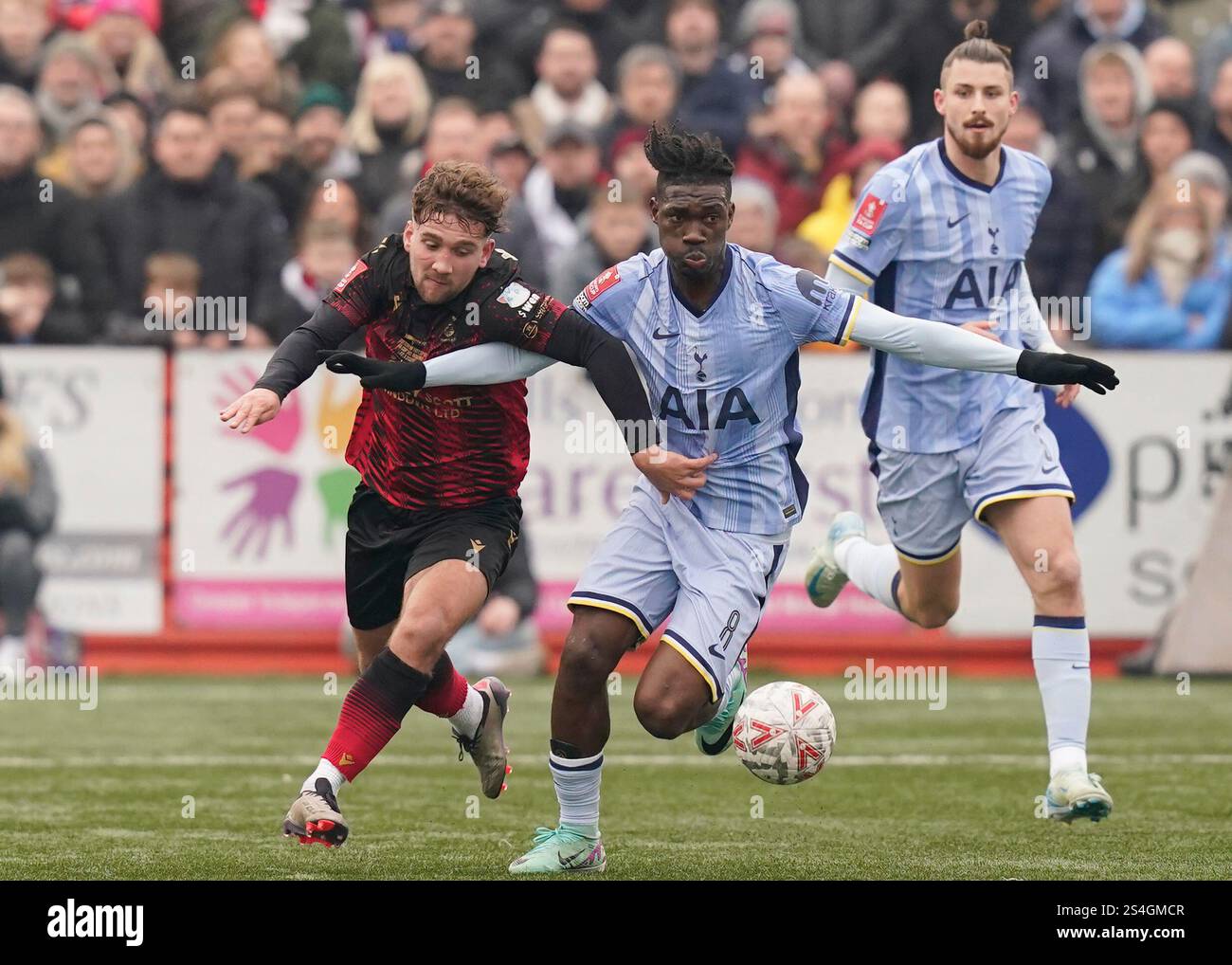 Tamworth, UK. 11th Jan, 2025. George Morrison of Tamworth tackles Yves ...
