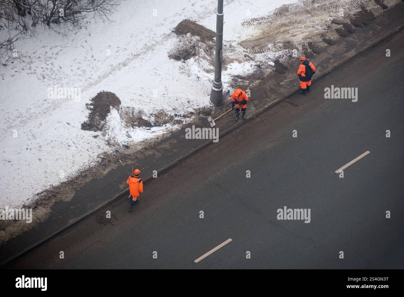 Construction workers in orange uniforms hi-res stock photography and ...