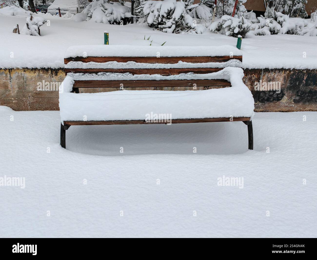 Snow-Covered Park Bench in Winter Stock Photo - Alamy