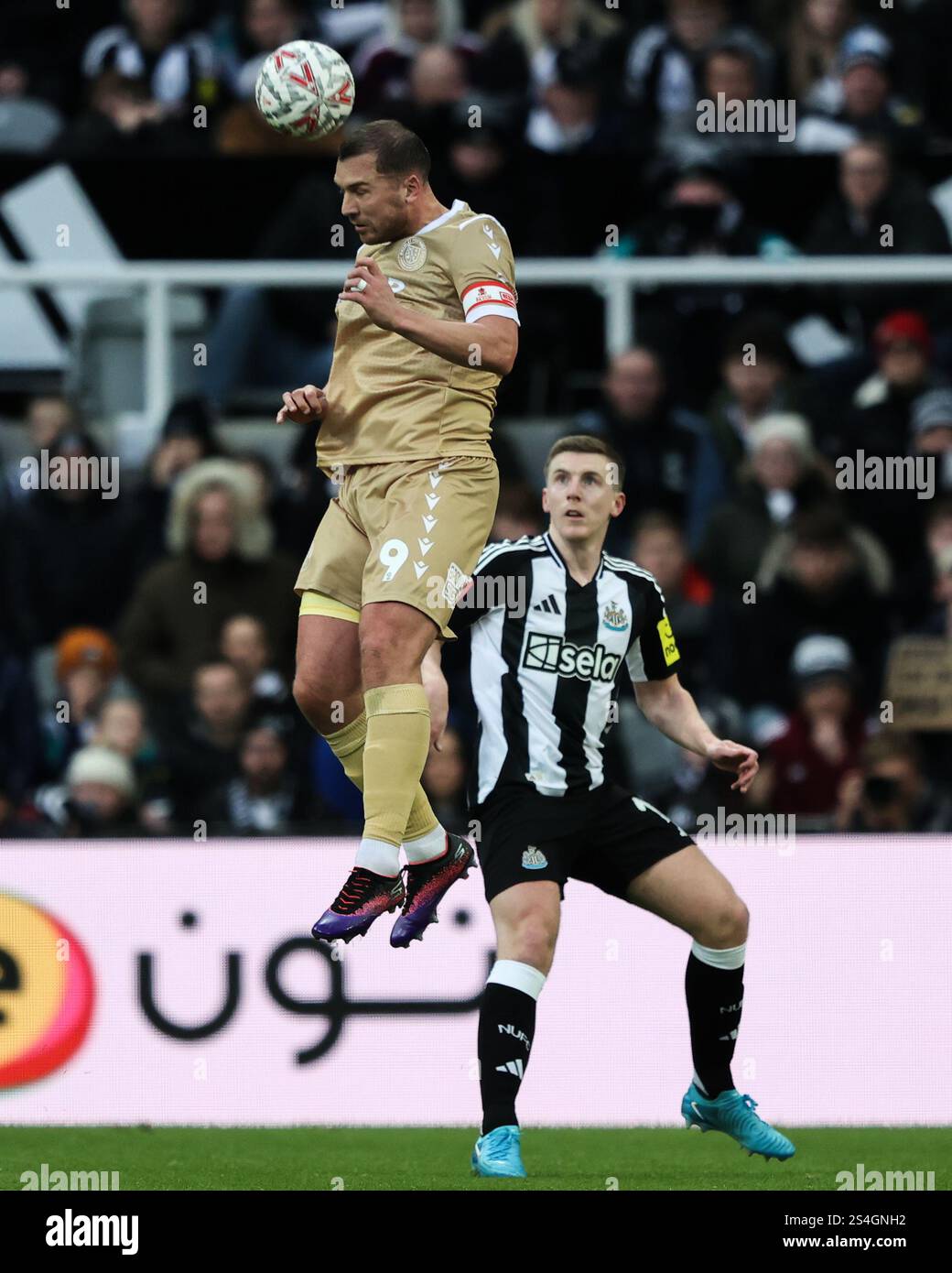 Newcastle, UK. 12th Jan, 2025. Michael Cheek of Bromley heads the ball ...