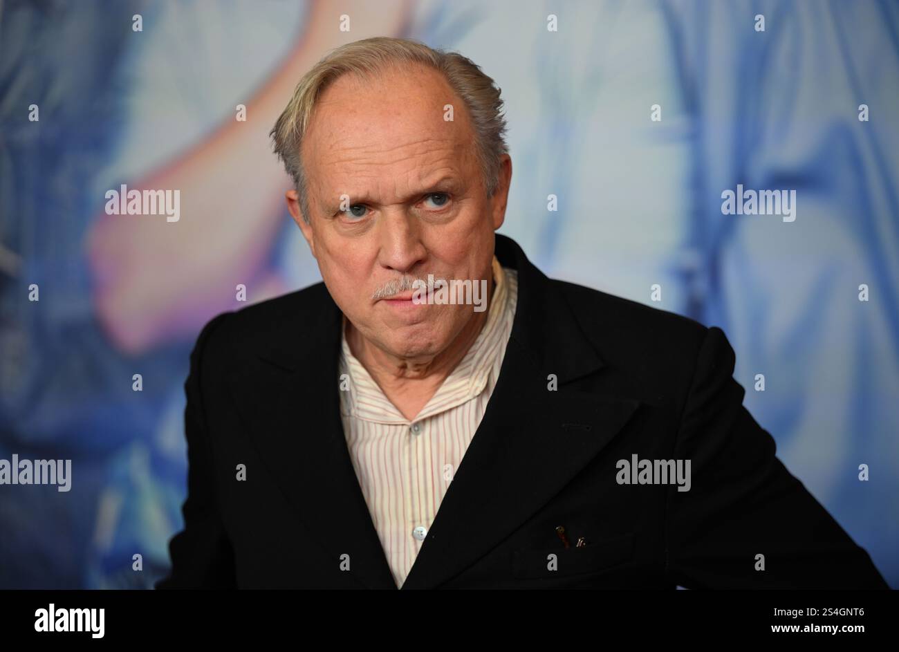 Munich, Germany. 12th Jan, 2025. Actor Ulrich Tukur stands on the red ...