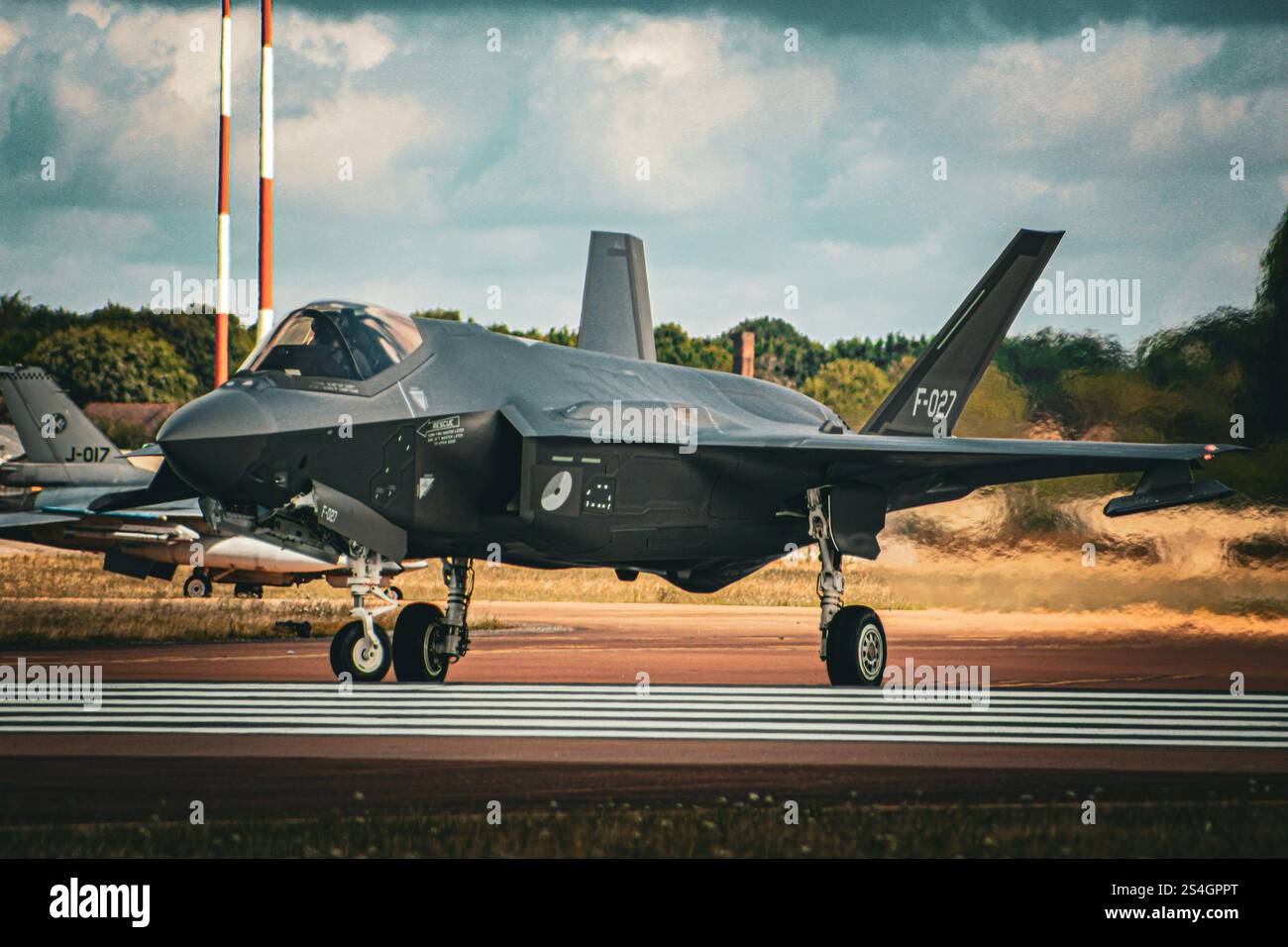 a fighter jet on an airport getting ready to take off Stock Photo - Alamy