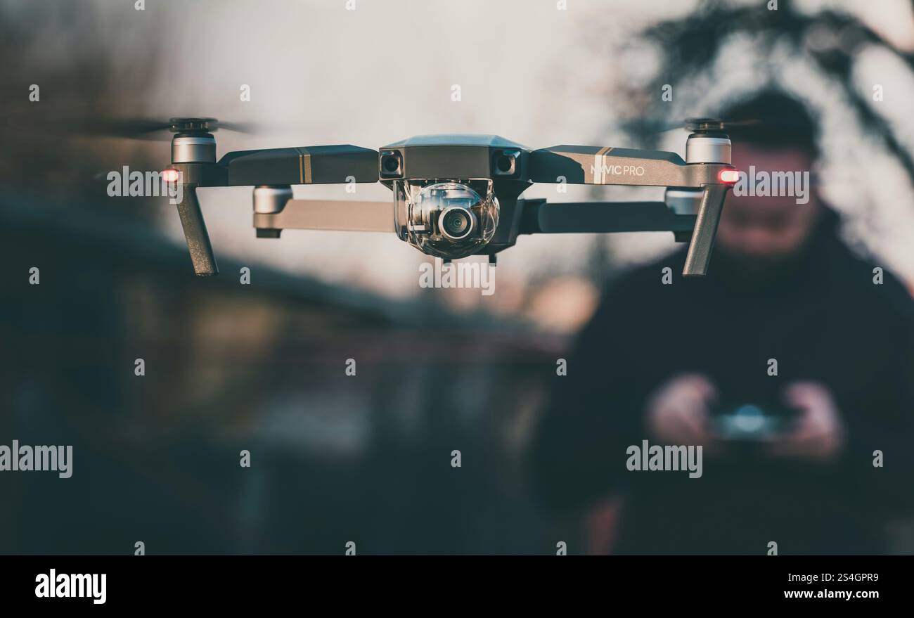 A man controlling a drone Stock Photo - Alamy