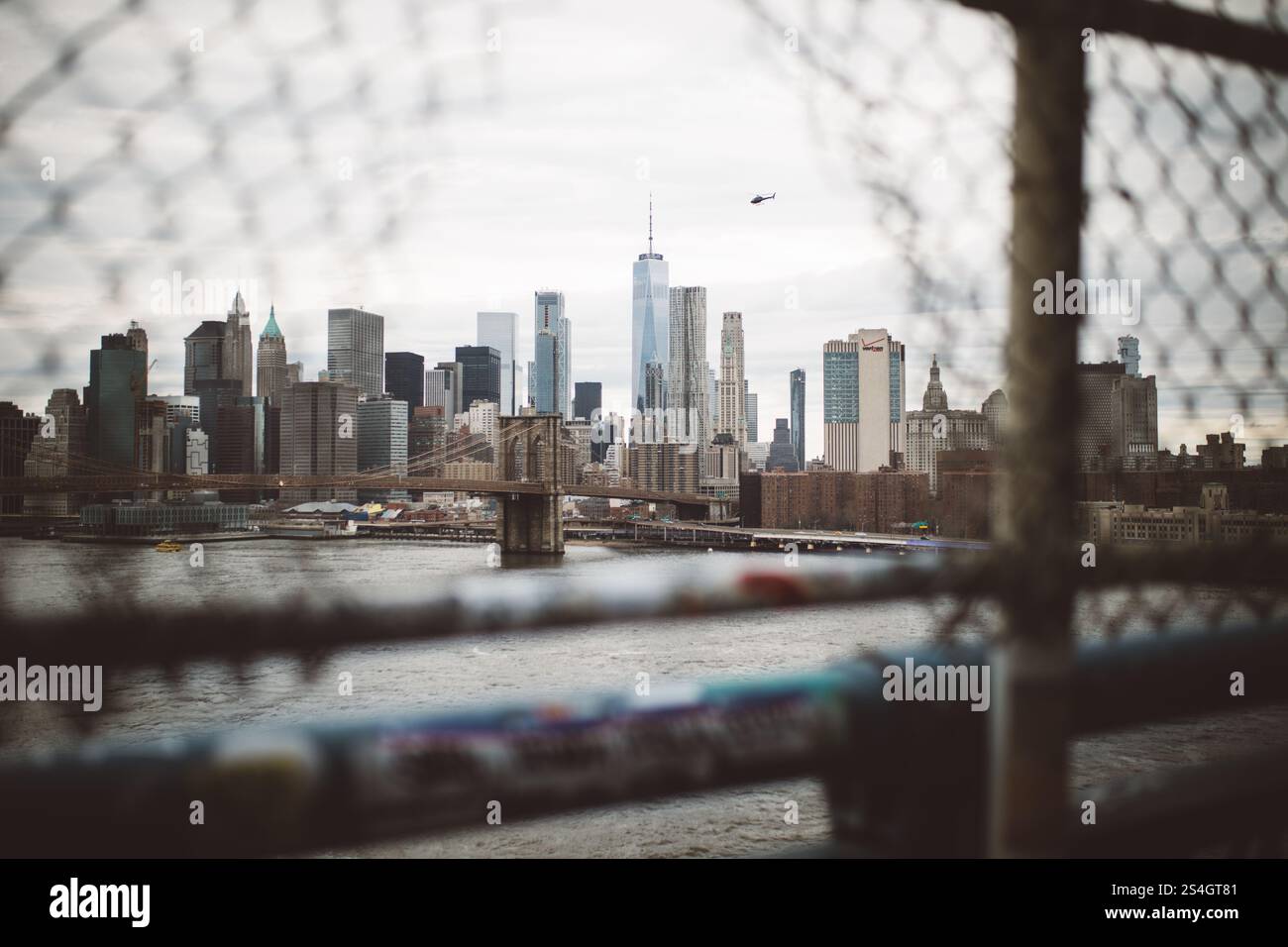 Brooklyn Bridge and Manhattan Skyline Through Chain-Link Fence Stock ...