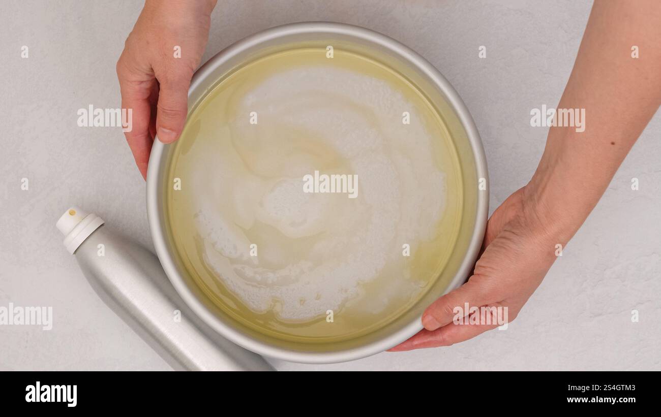 Baking pan coated with a sheen of glistening oil, baking process Stock ...