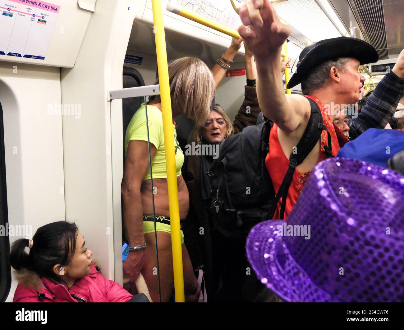 London, UK. 12th Jan 2025 People take part in the 2025 No Trousers Tube ...