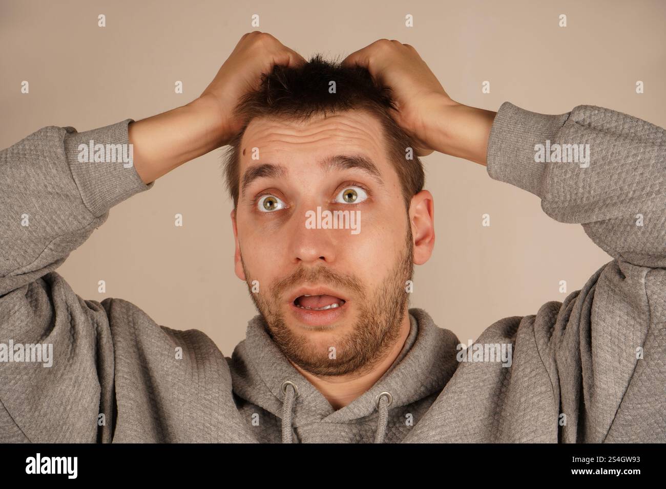 The image highlights his reaction to intense thoughts or stress. His ...